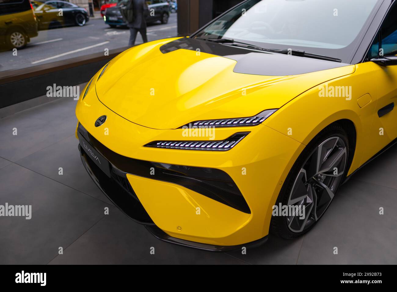 new yellow battery-Electric Hyper-GT Lotus Emeya in showroom, British ...