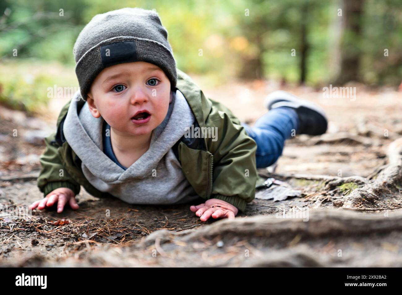 Boy hurt after falling in the forest sad and unhappy child crying Stock ...