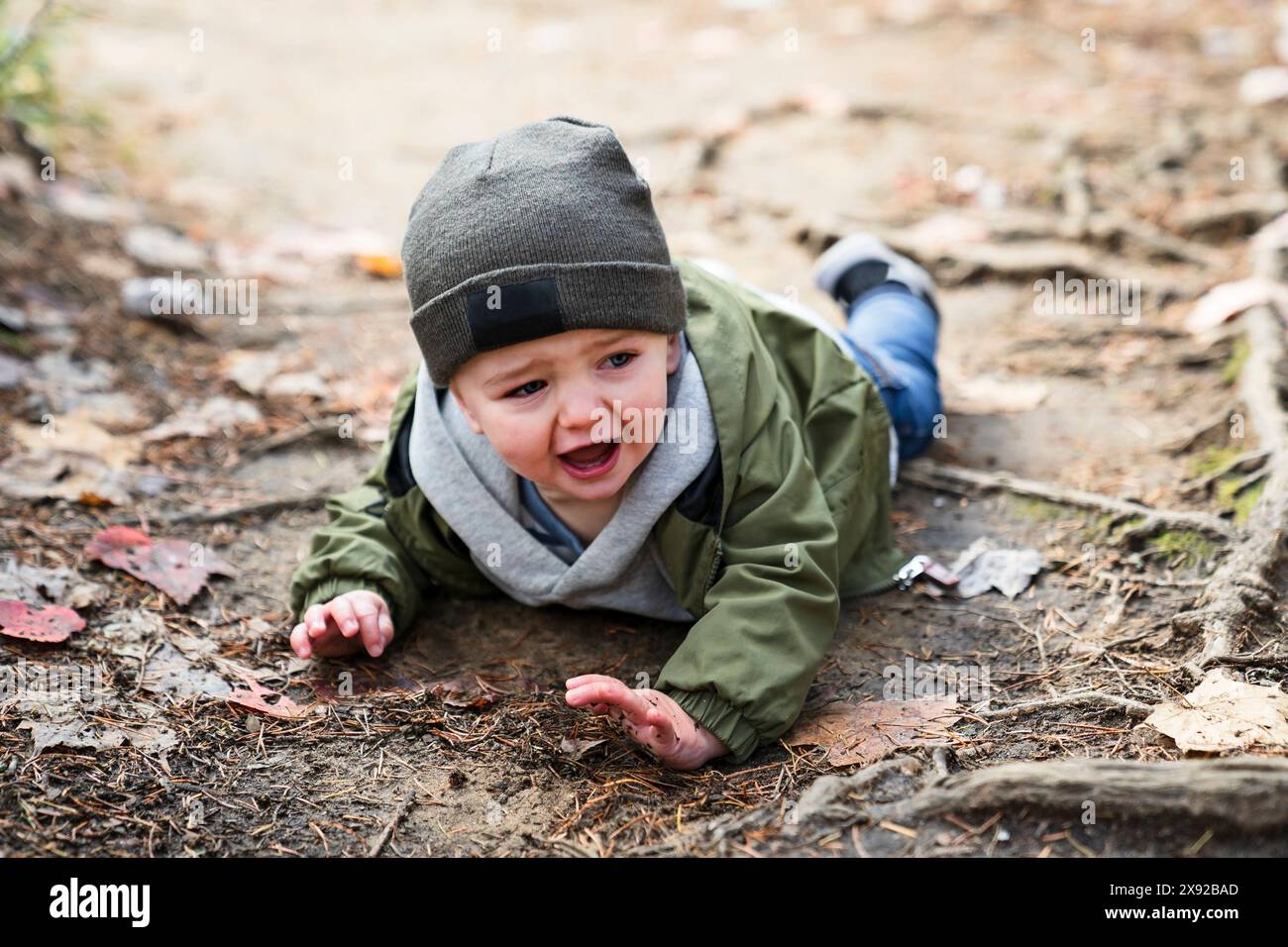 Boy hurt after falling in the forest sad and unhappy child crying Stock ...