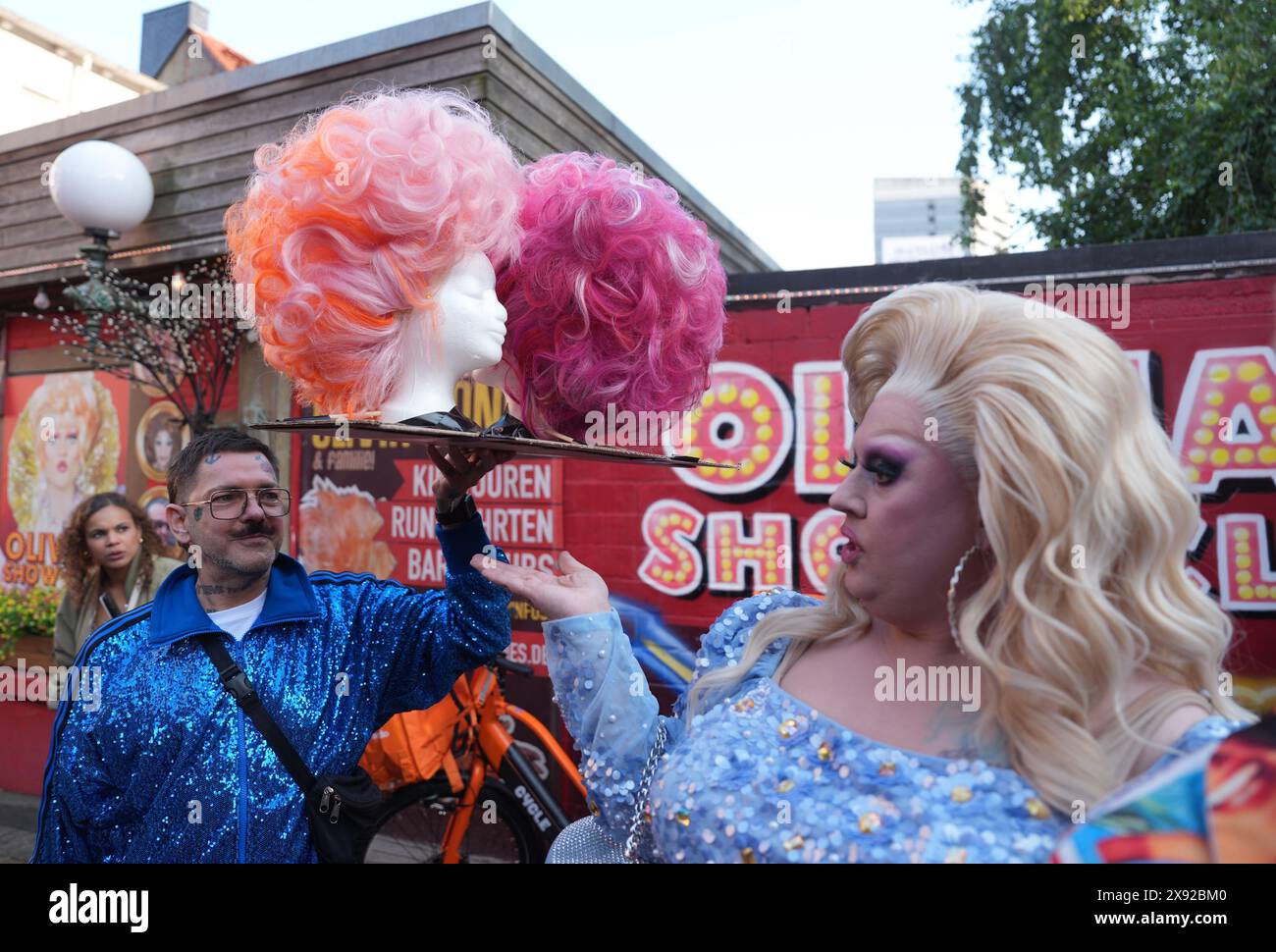 Hamburg, Germany. 28th May, 2024. Designer Karl Gadzali (l) brings the ...