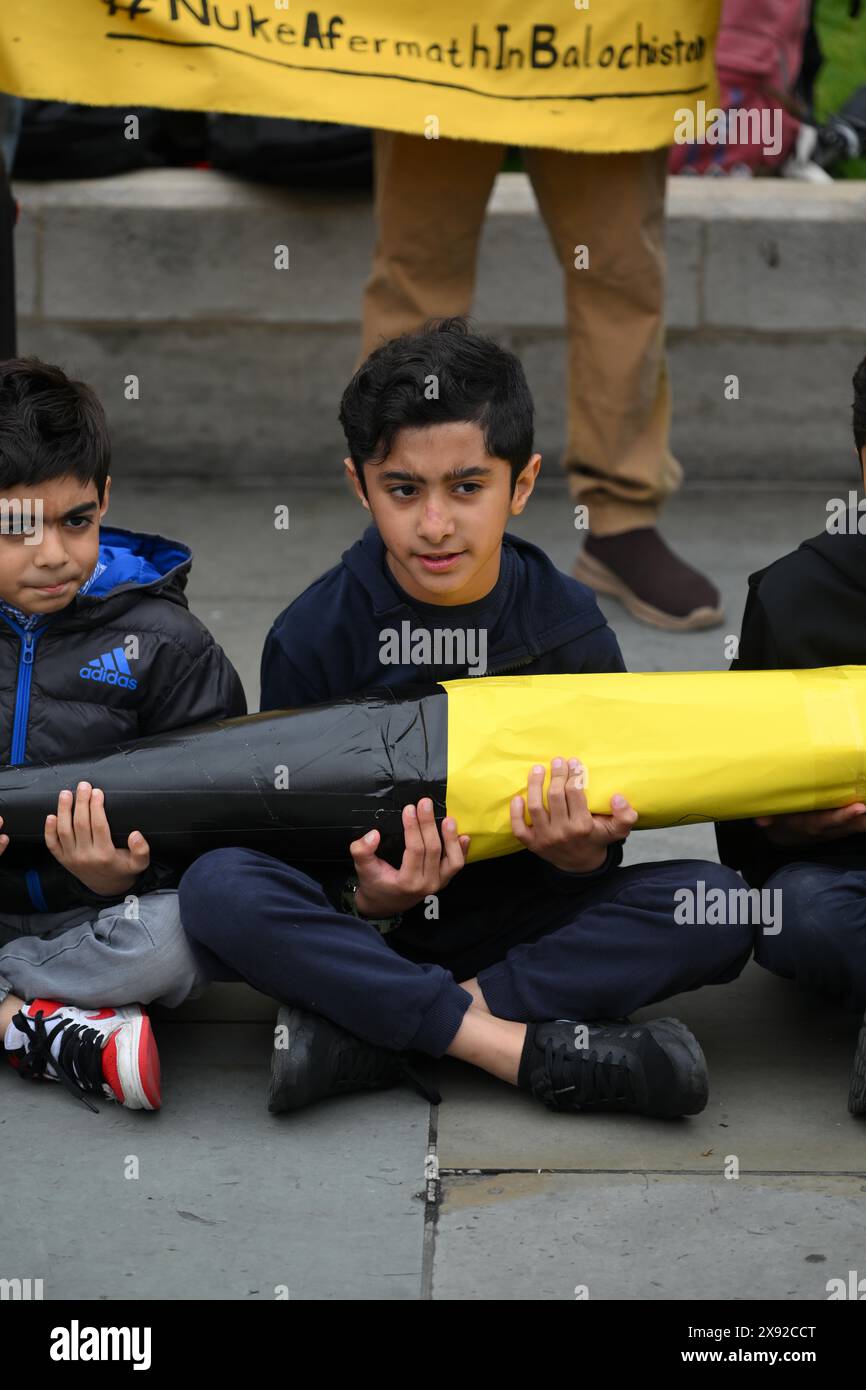 London, England, UK. 28th May, 2024. Children hold a makeshift nuclear ...