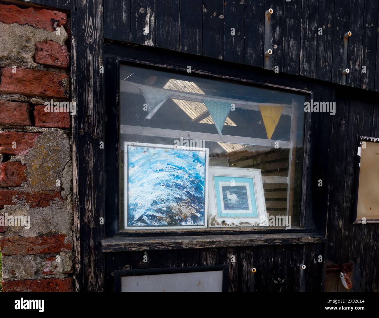 Forgotten art in a disused gift shop at Lizard Point, Cornwall Stock ...