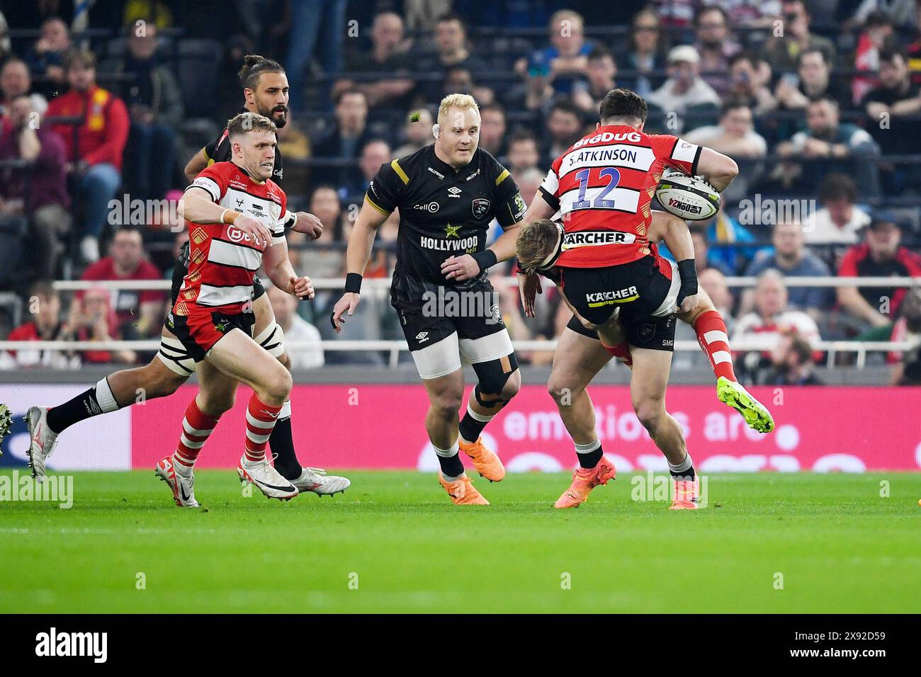 Gloucester Rugby Centre Seb Atkinson (12) is tackled by Hollywoodbets ...