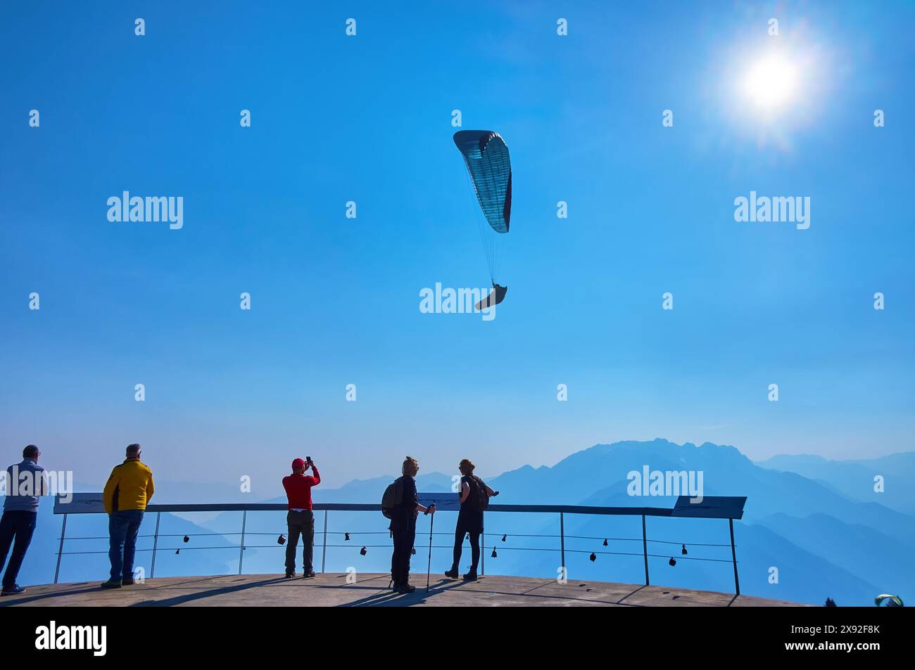 The glider aircraft in the sunny sky over the viewing platdorm of ...