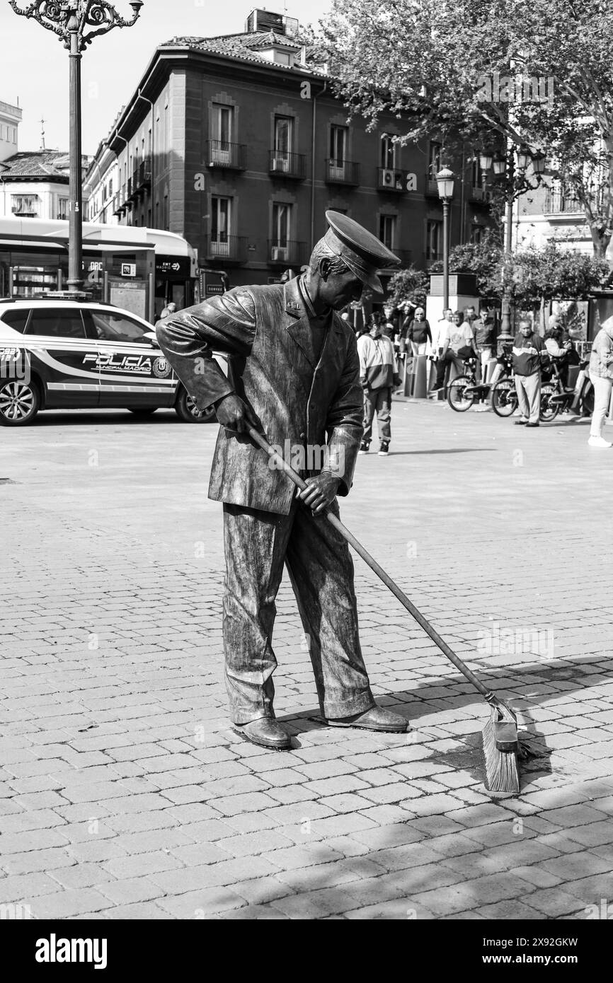 Madrid, Spain- April 8, 2024: Bronze statue , tribute to the Madrid sweepers ,by the artist ...