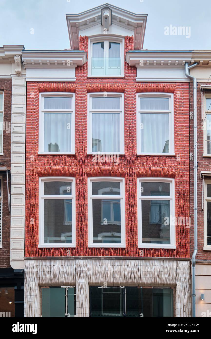 Netherlands, Amsterdam - April 10, 2024: 3D printed ceramic tiled facade in Hooftstraat ...