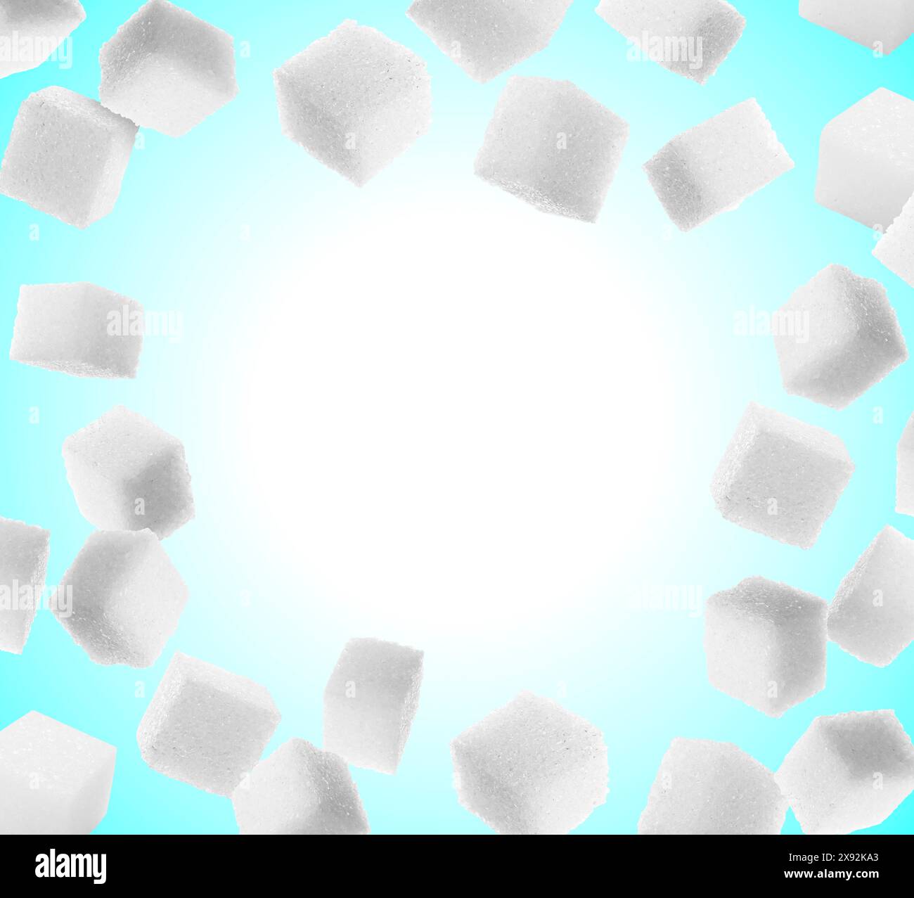 Refined sugar cubes in air on light blue gradient background. Space for ...