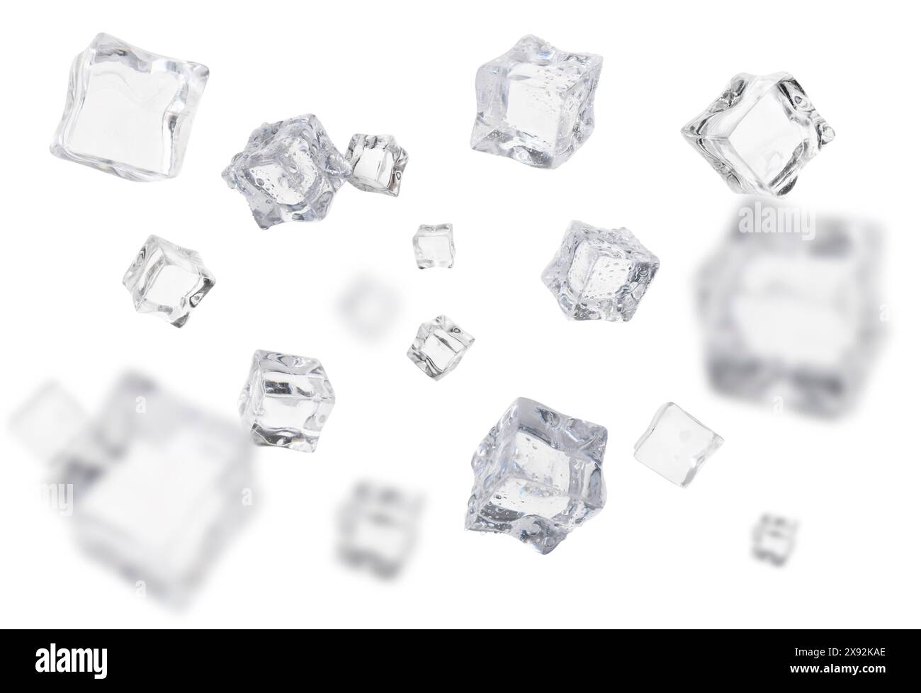 Many ice cubes in air on white background Stock Photo - Alamy