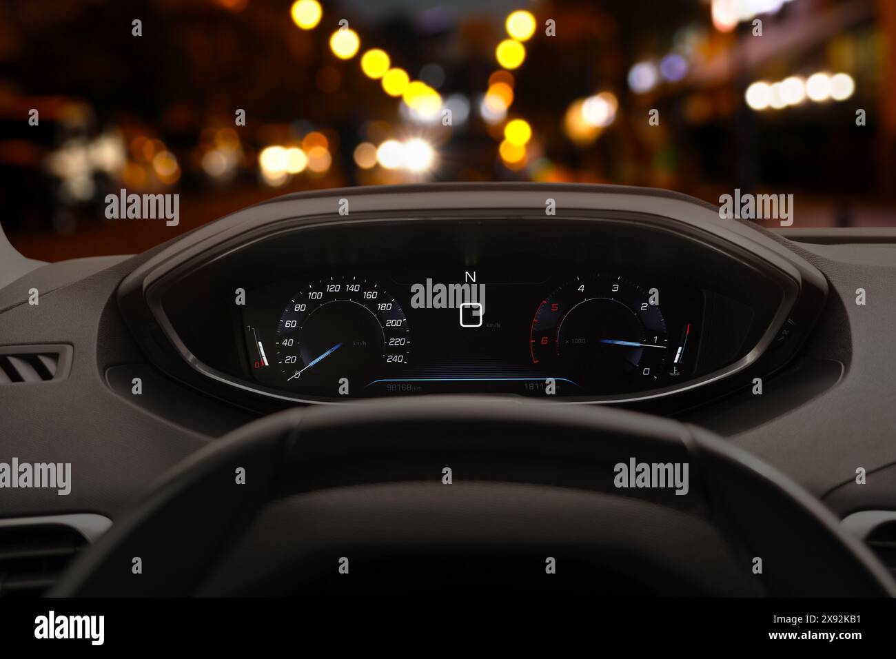 Dashboard with speedometer behind steering wheel inside car Stock Photo ...