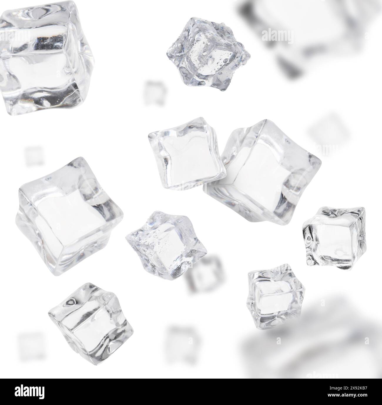 Many ice cubes in air on white background Stock Photo - Alamy