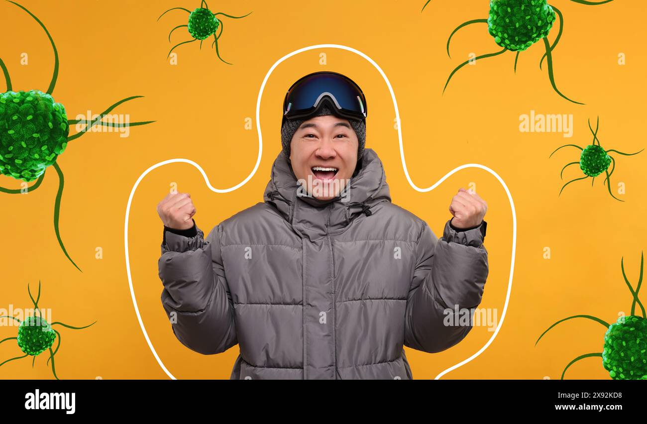 Man with strong immunity surrounded by viruses on orange background ...