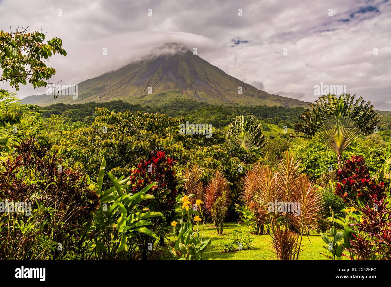 Early morning view over the Arenal Volcano on a stormy day, La Fortuna ...