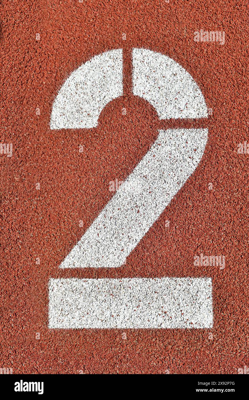 Number two on a red runway is numbered at a stadium Stock Photo - Alamy