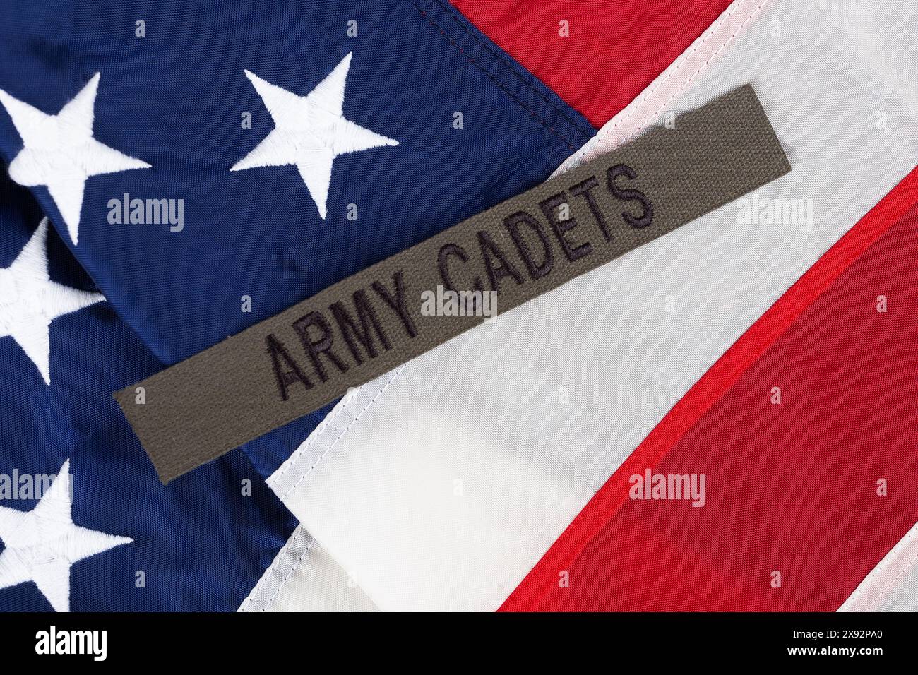US ARMY CADETS Branch Tape on national USA flag background Stock Photo ...