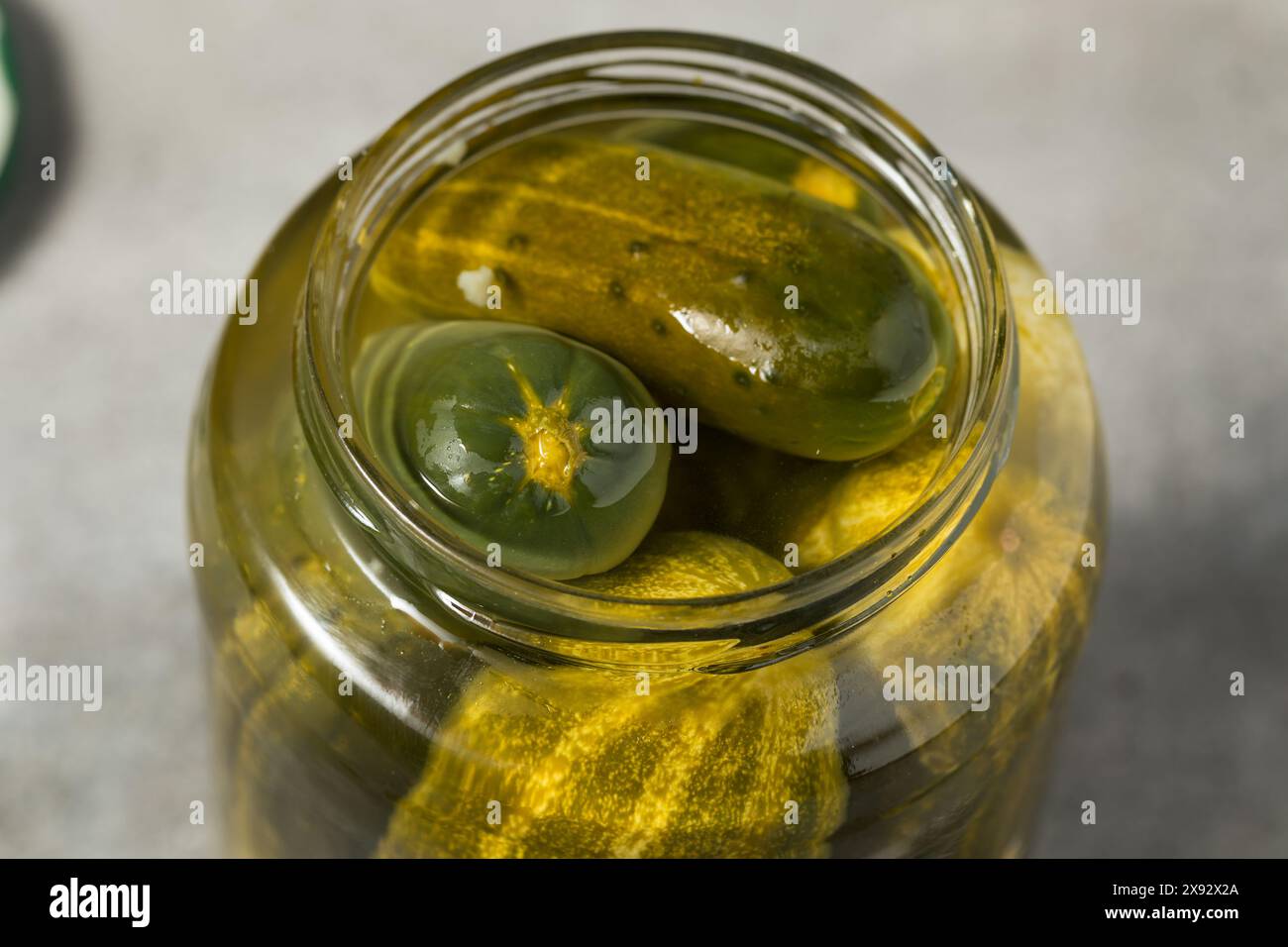 Sour Whole Dill Pickles in a Glass Jar Stock Photo - Alamy