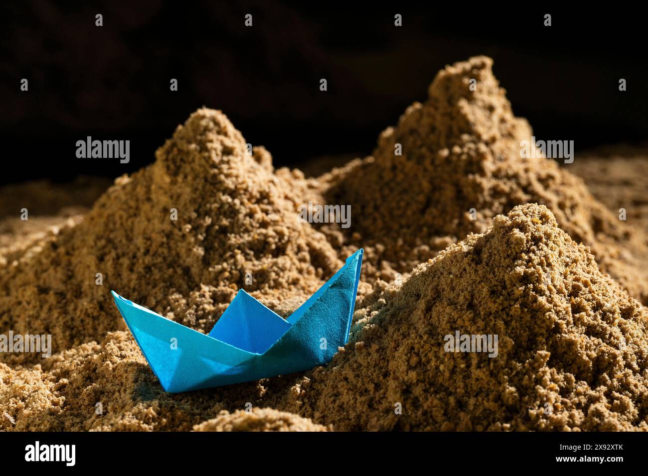 Blue handmade paper boat in the sand dunes - Art for decoration Stock ...