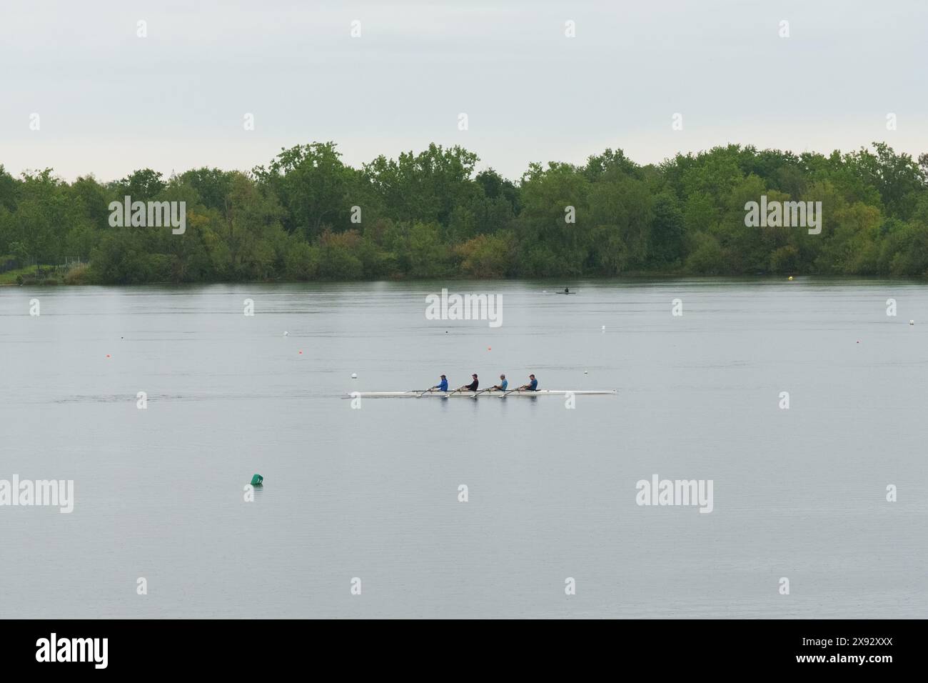 Bordeaux, France - April 26, 2023: A group of people rowing a boat on a ...