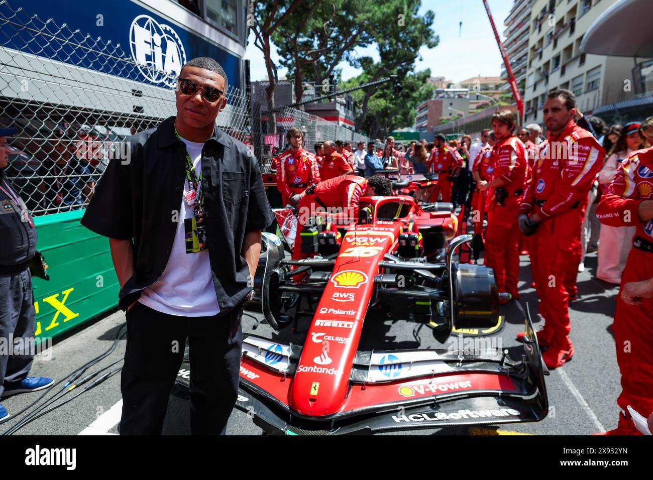 Footballer Kylian Mbappe on the starting grid with the Scuderia Ferrari ...