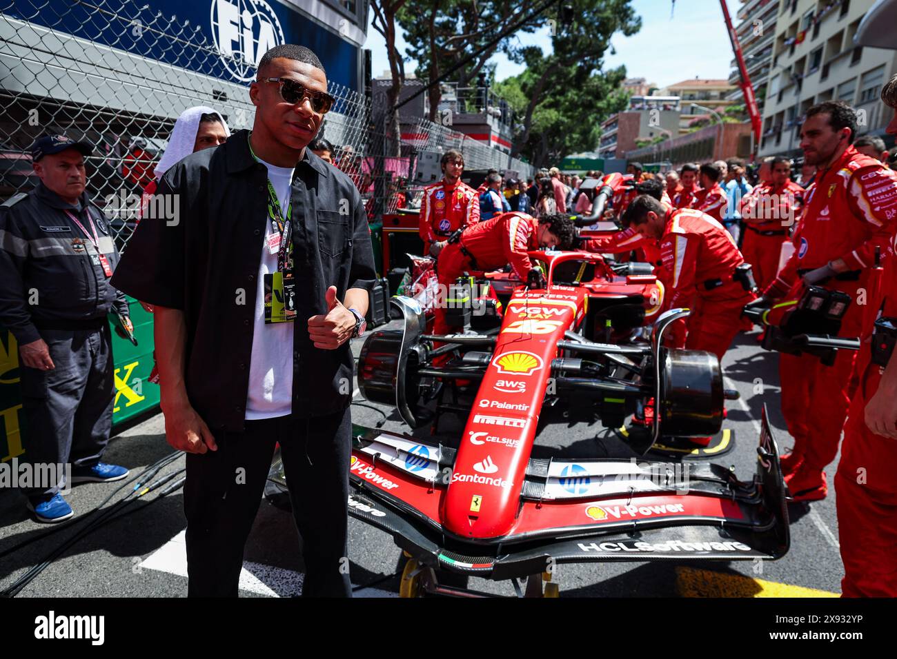 Footballer Kylian Mbappe on the starting grid with the Scuderia Ferrari ...