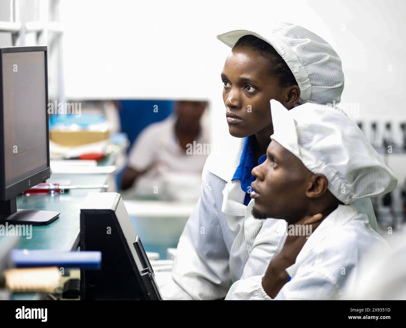 Mbale, Uganda. 28th May, 2024. People work at Chint Meters & Electrical Uganda Electric Co., Ltd ...