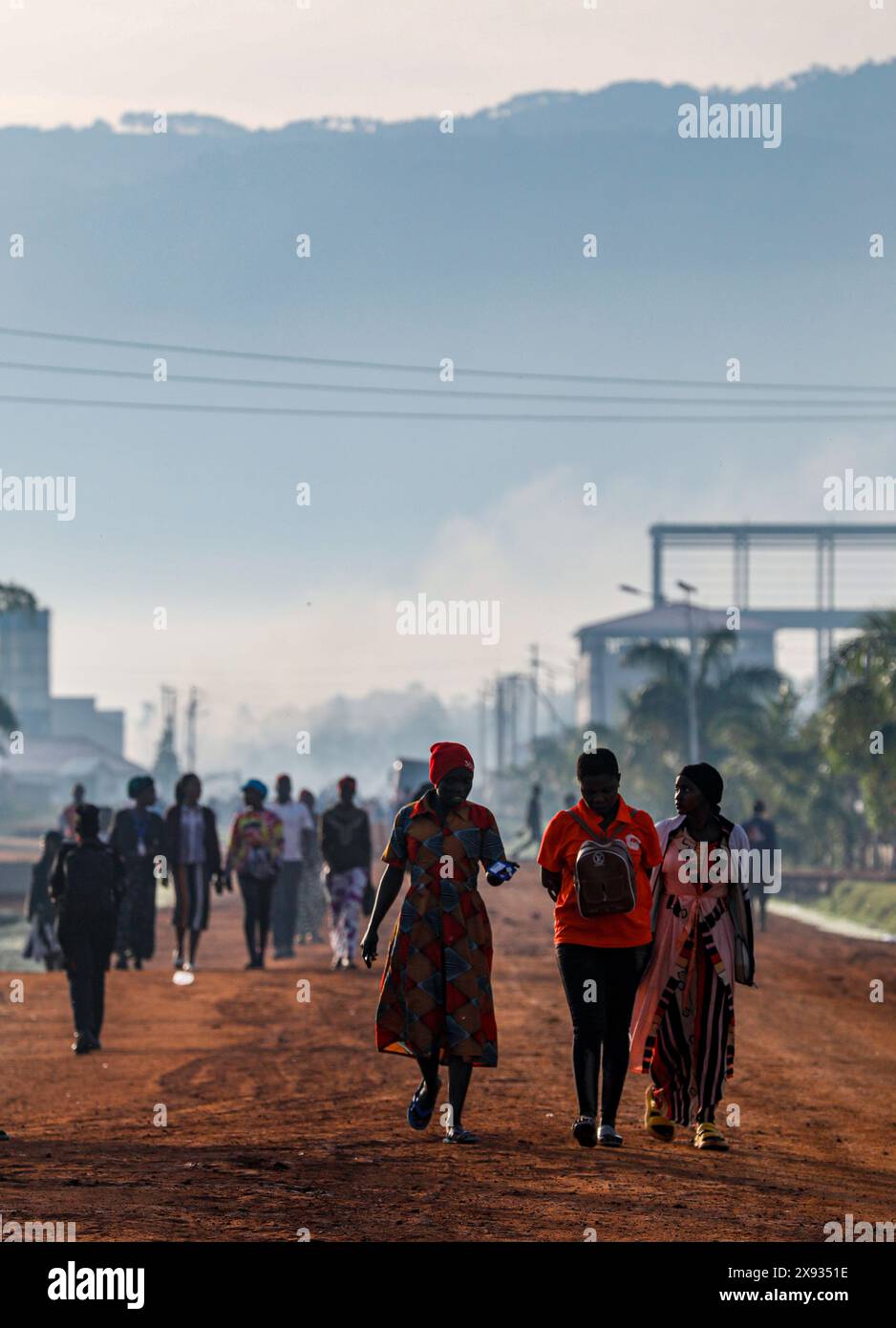 Mbale, Uganda. 28th May, 2024. People are seen on their way to the Sino ...
