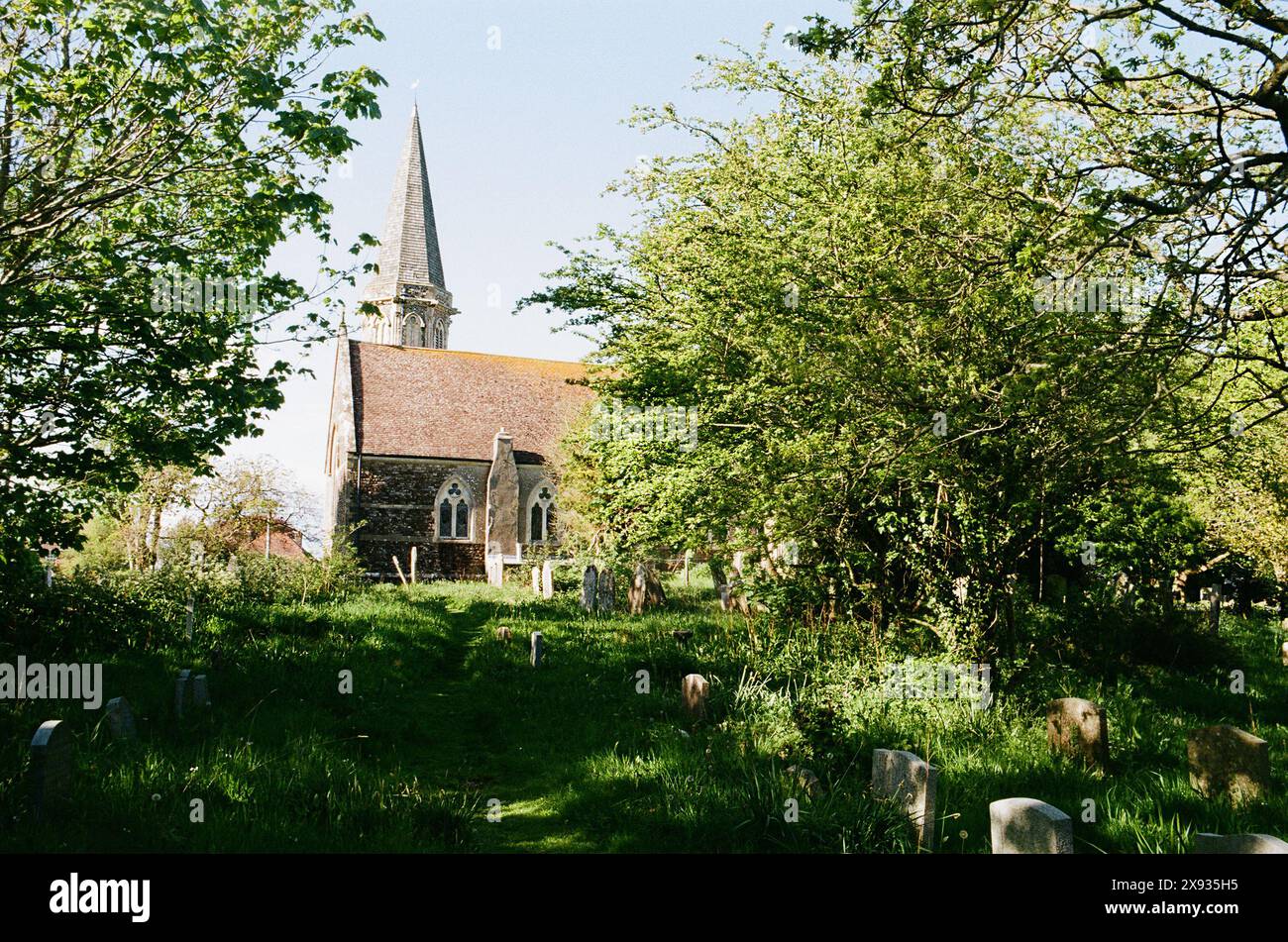 The churchyard of St Mary and St Peter at the village of Pett, near ...