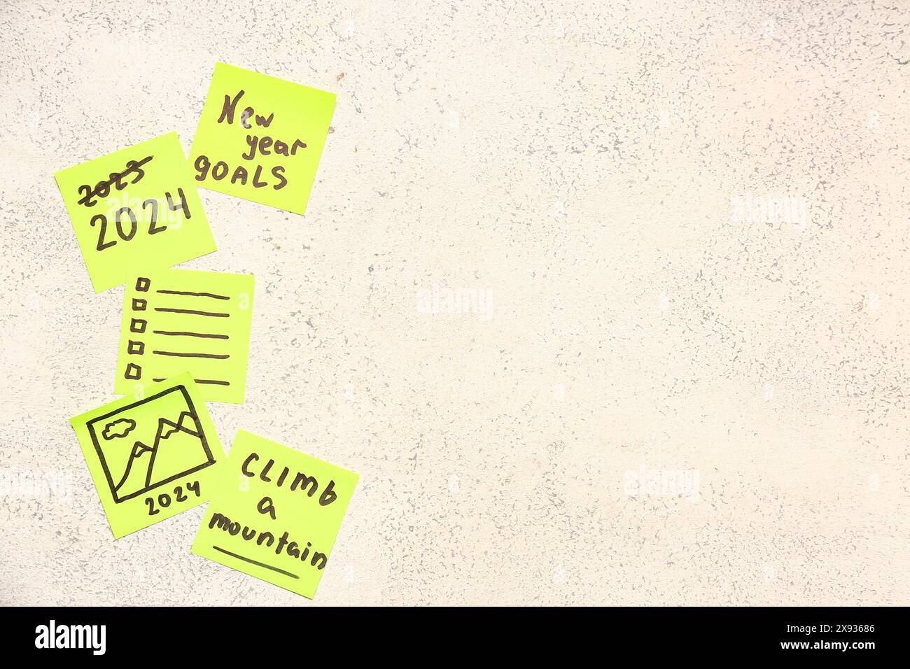 Sticky notes with different goals for 2024 on grunge white background ...