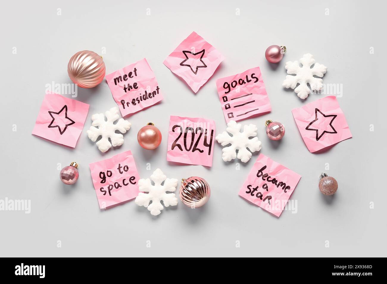 Sticky notes with different goals for 2024 and Christmas decorations on ...