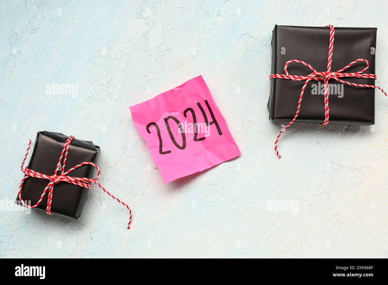 Sticky note with year 2024 and gift boxes on gradient background Stock ...