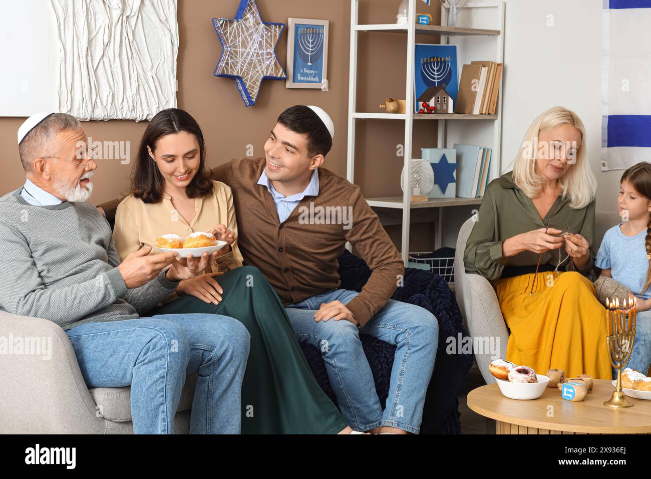 Happy Jewish family celebrating Hanukkah at home Stock Photo - Alamy