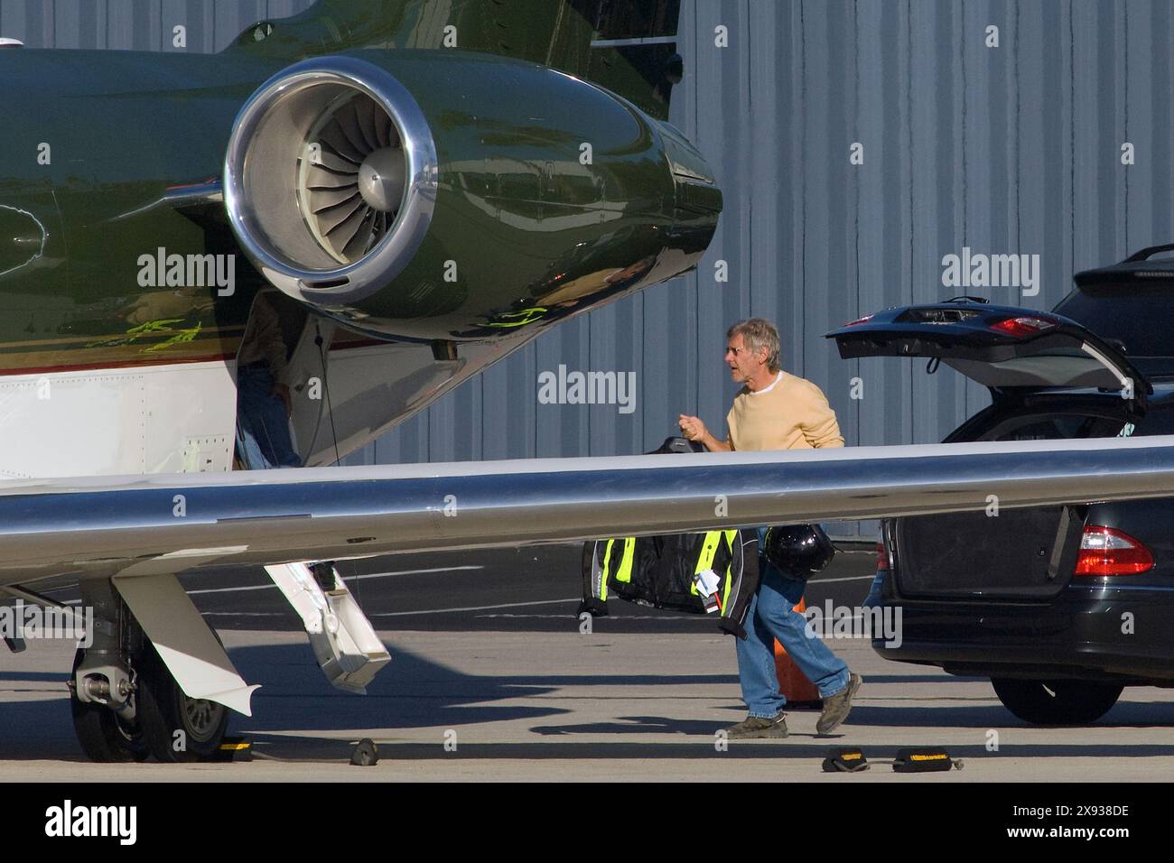 Exclusive. Harrison Ford left for the Labor Day weekend with his wife ...