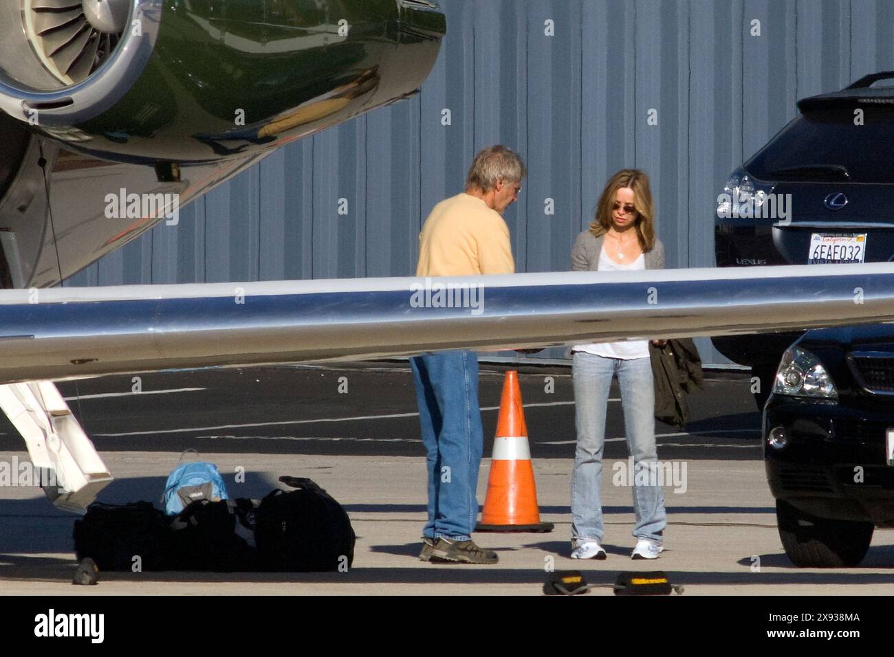 Exclusive. Harrison Ford left for the Labor Day weekend with his wife ...