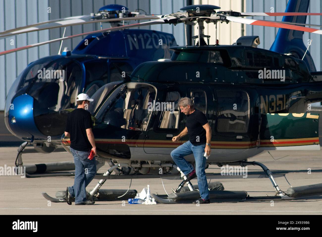 EXCLUSIVE-- Harrison Ford check and clean the windows of his helicopter ...