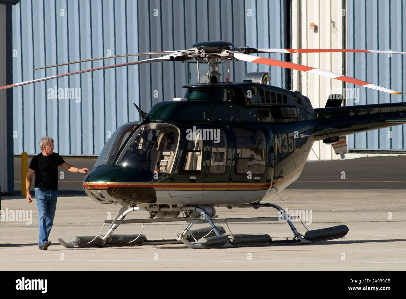 EXCLUSIVE-- Harrison Ford check and clean the windows of his helicopter ...