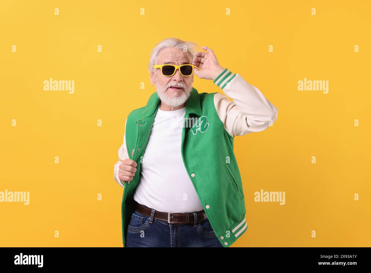 Portrait of grandpa with stylish sunglasses on yellow background Stock ...