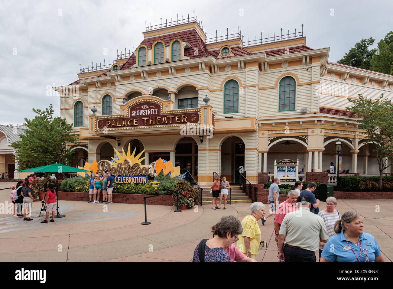 Groups of guests get photos taken in front of the Showstreet Palace ...