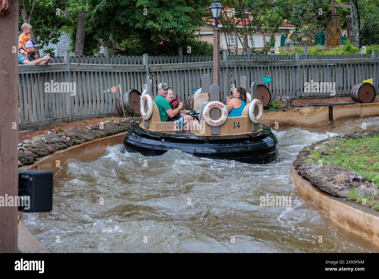 Park guests ride the Smoky Mountain River Rampage at the Dollywood amusement park in Pigeon ...