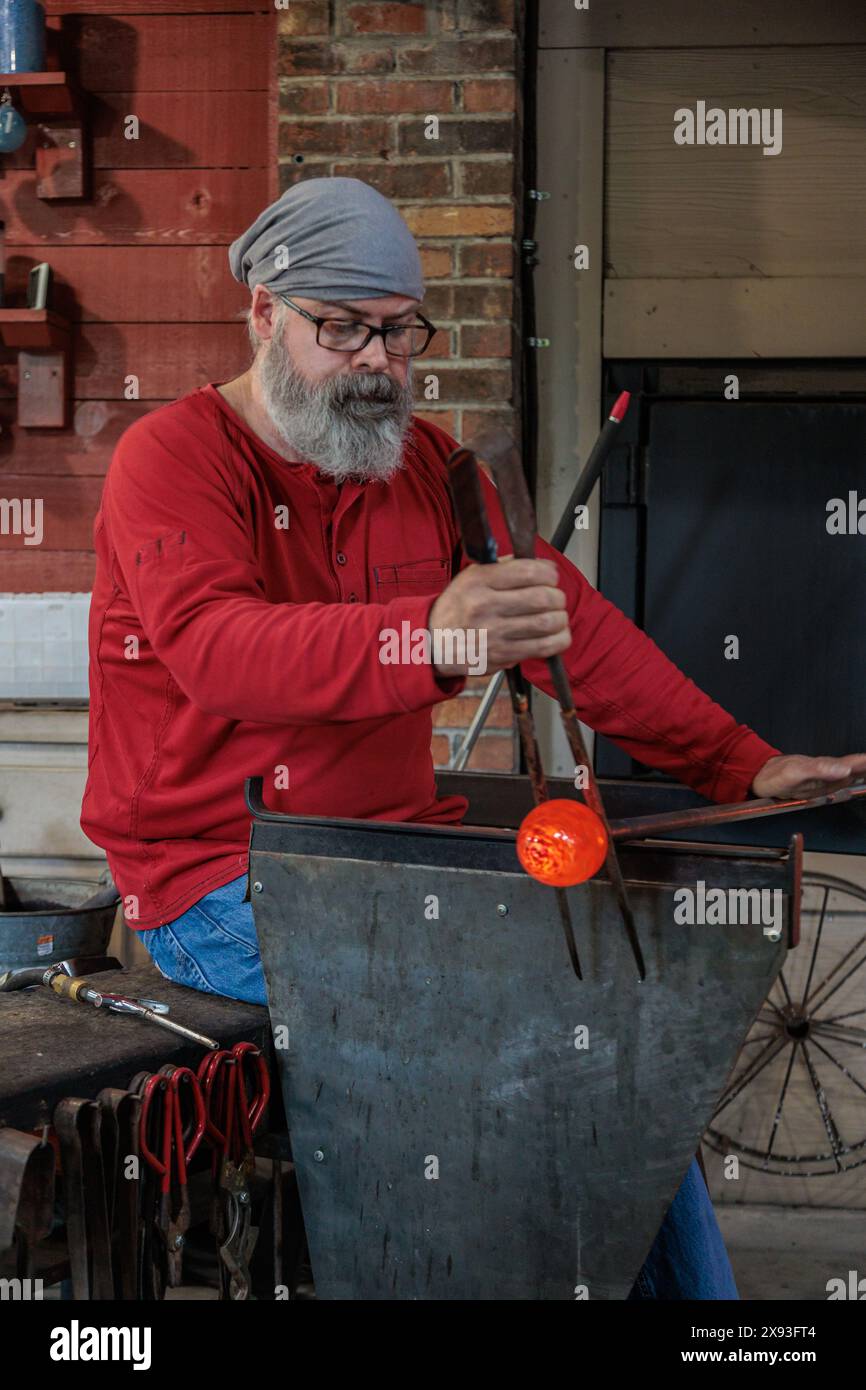 Glass blower demonstrates the art of blowing glass at the Dollywood ...
