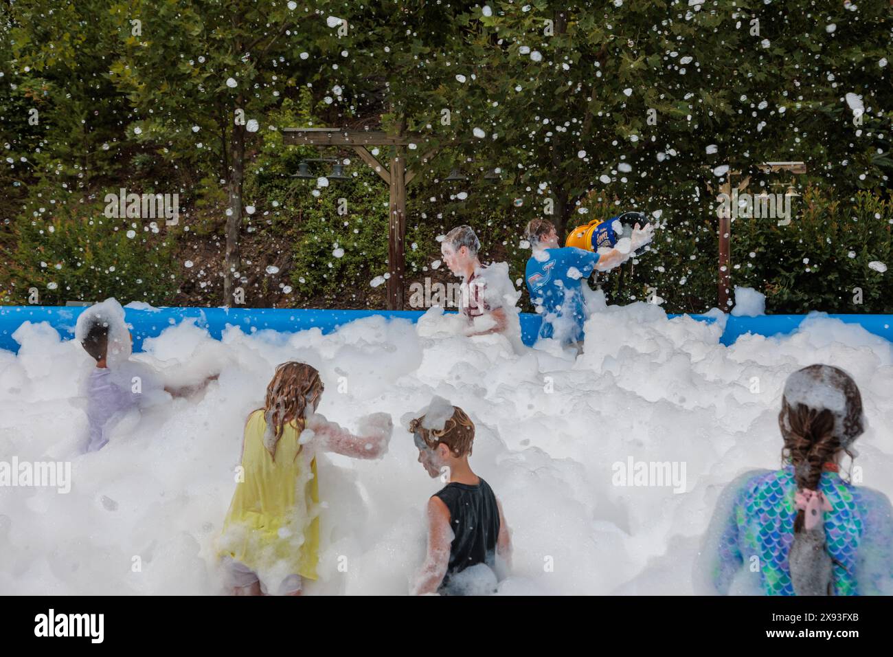 Park guests playing in the bubble foam pit at the Dollywood amusement ...