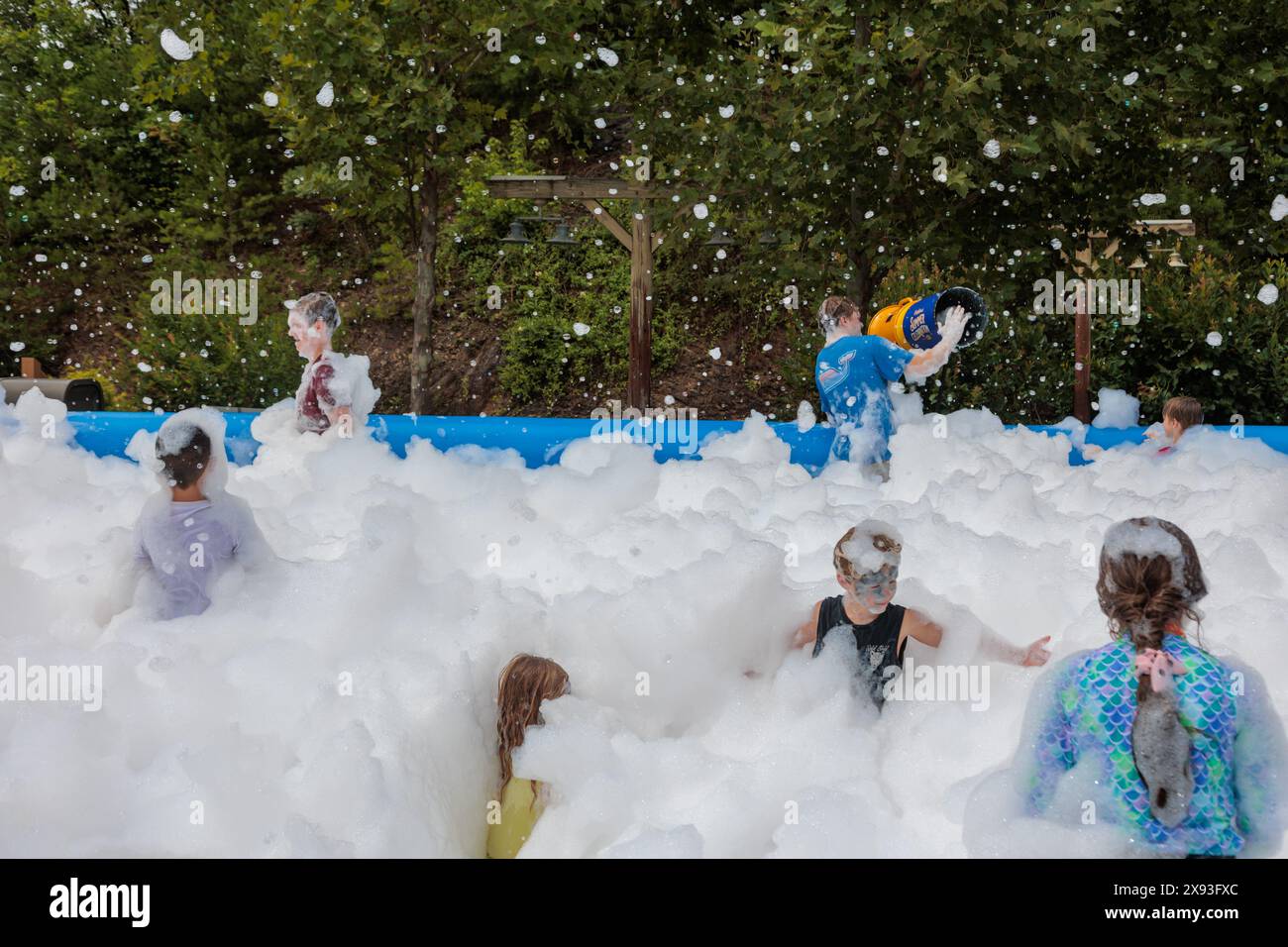 Park guests playing in the bubble foam pit at the Dollywood amusement ...