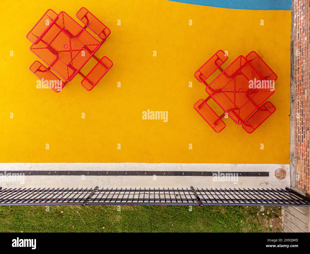 Aerial, drone, photo, of a red vinyl coated picnic tables on a multi ...