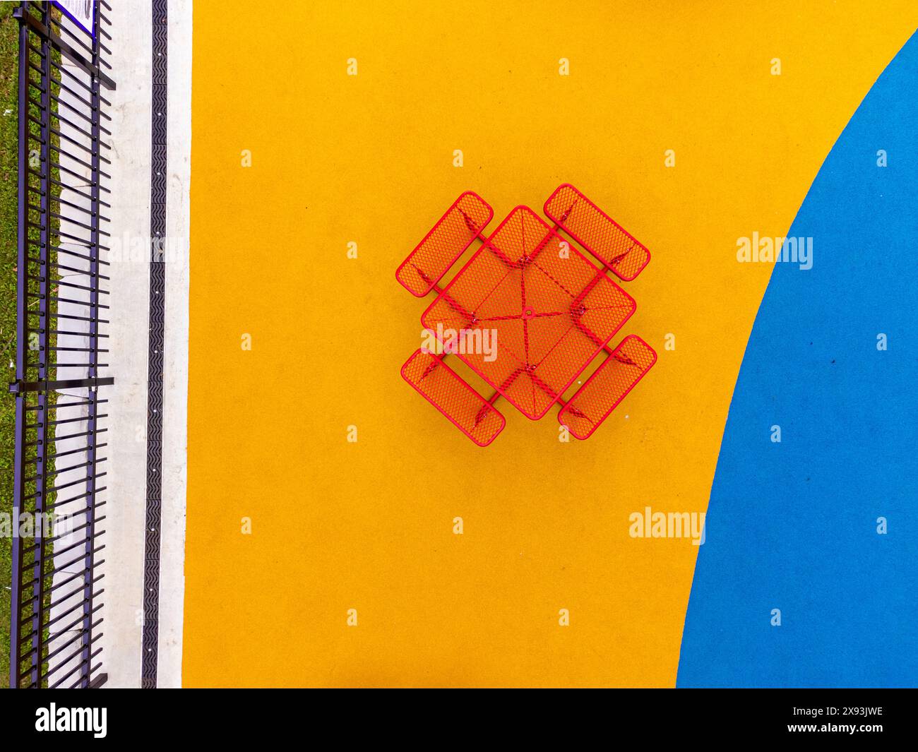 Aerial, drone, photo, of a red vinyl coated picnic tables on a multi ...