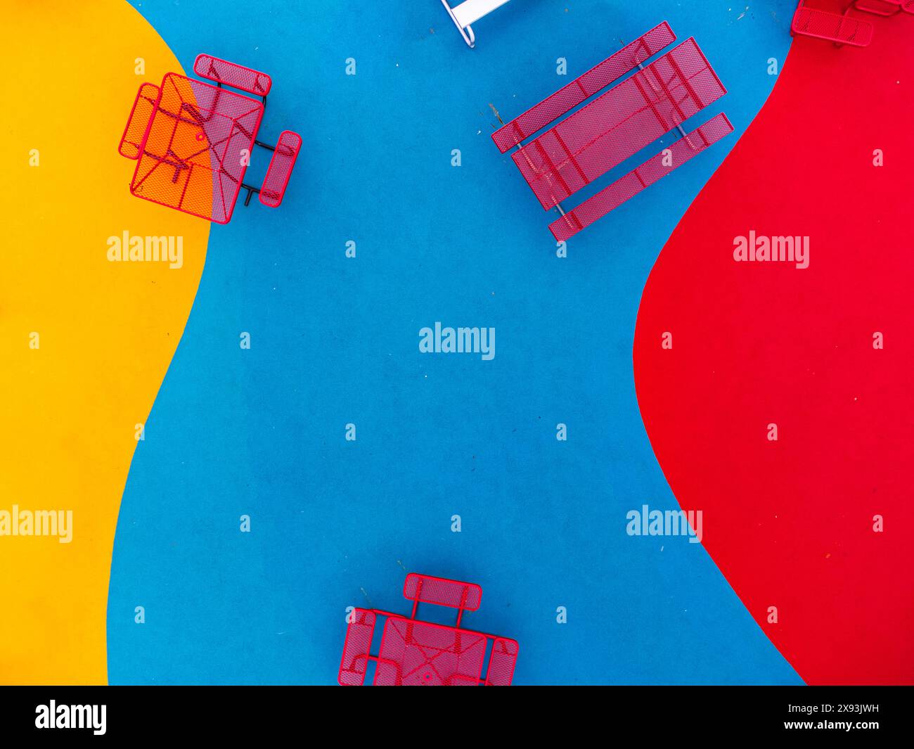 Aerial, drone, photo, of a red vinyl coated picnic tables on a multi ...