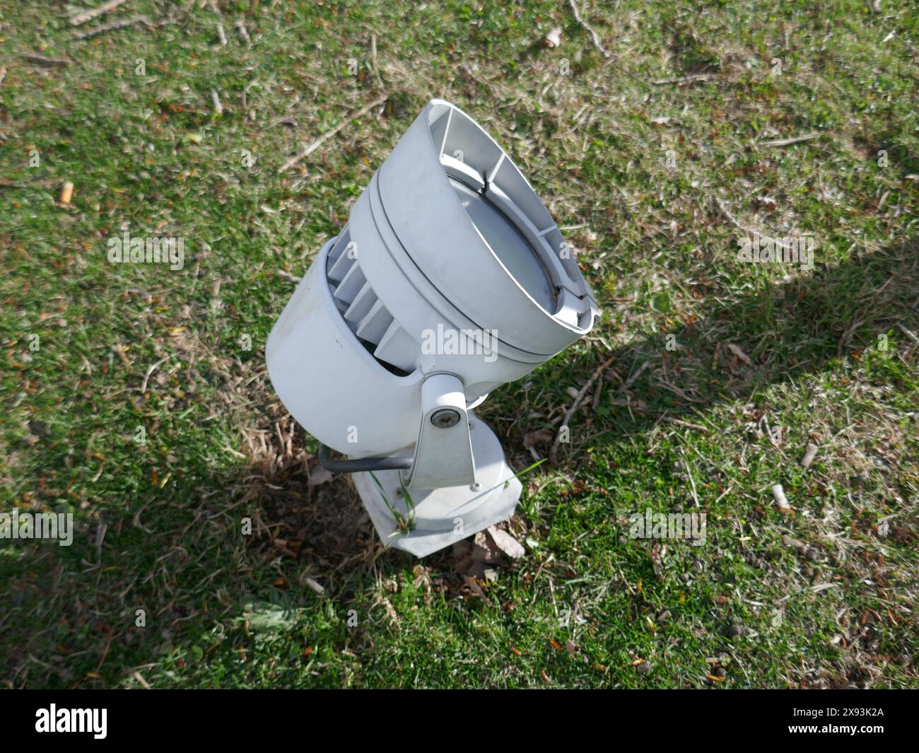 Outdoor ground mount spotlight on lawn in public area Stock Photo - Alamy