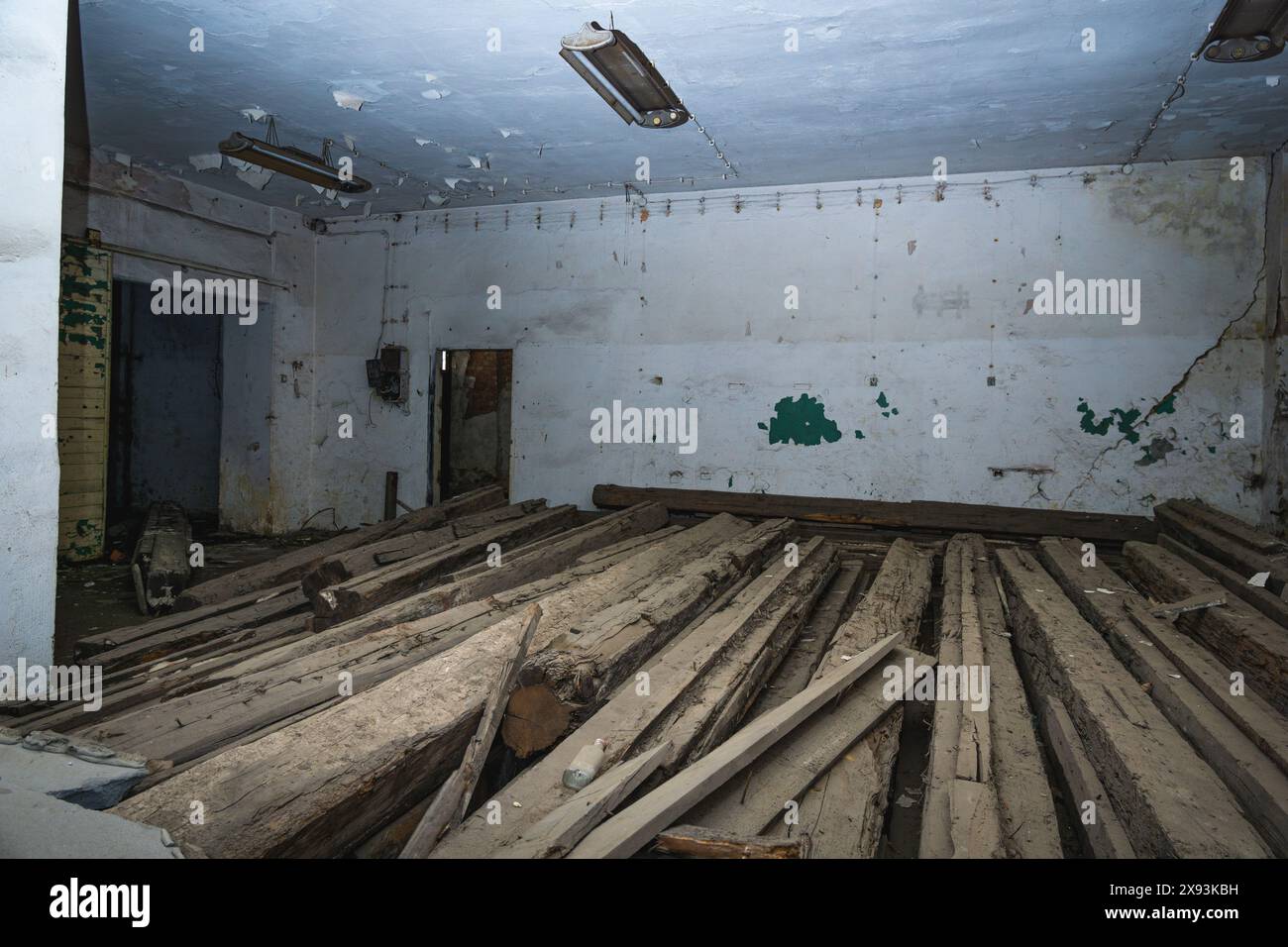 Old ruin room covered in dust with broken wooden logs in desolated ...