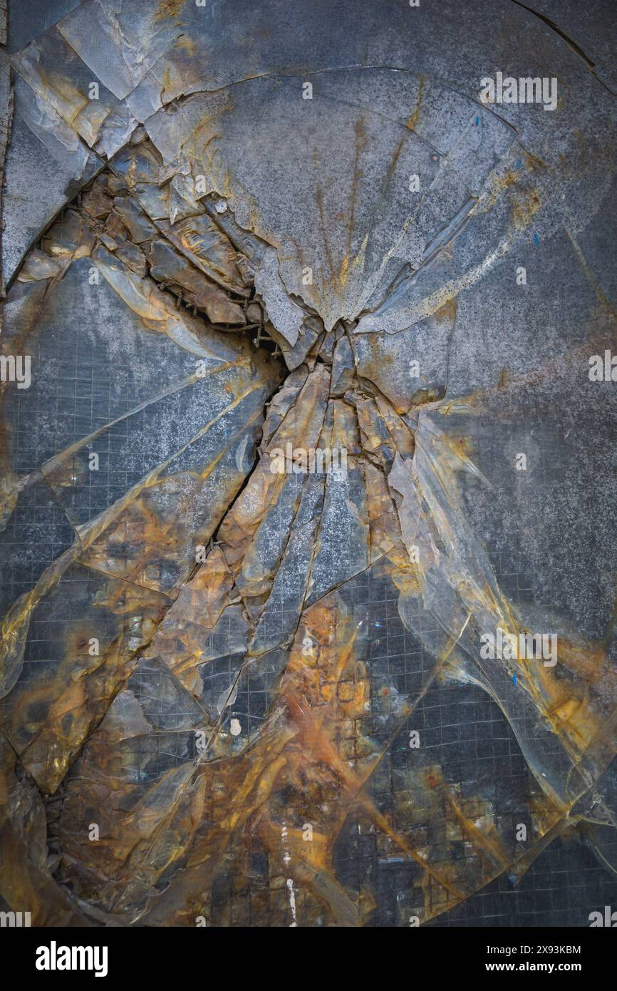 Broken Glass Window With Rusted Metal Grate Stock Photo - Alamy