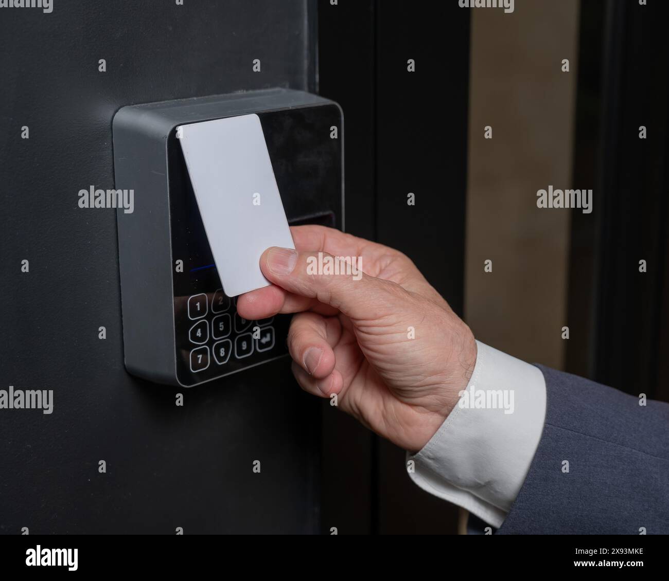 A man opens the door with a card. Modern electronic lock. Keyless Entry ...