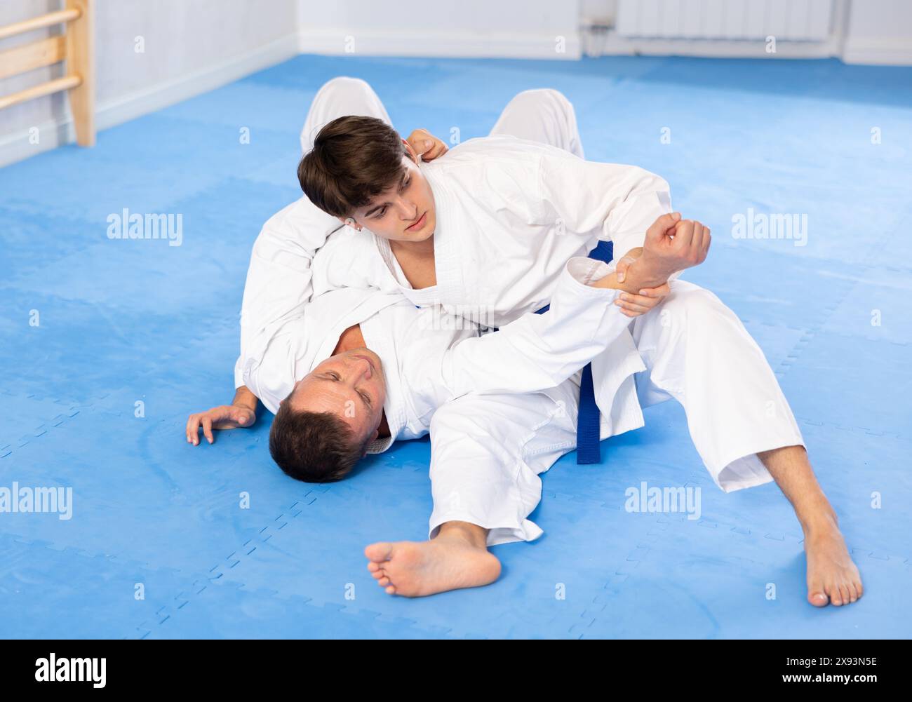 Guy paired up man in sparring practice elbow strike with wrist grip on ...