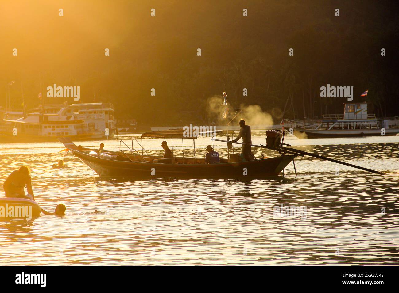 Asian vietnamese wooden boat on sea surface at sunset. Vietnam culture ...