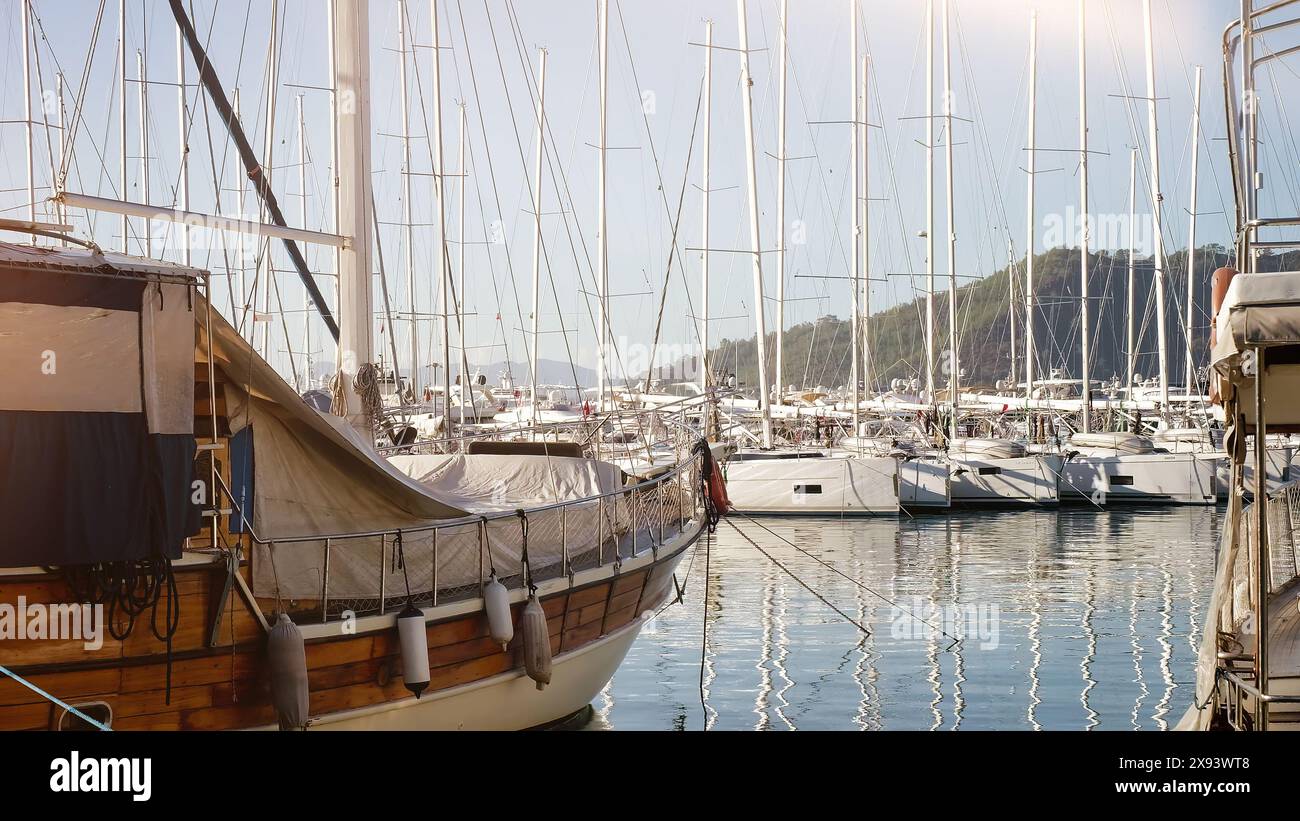 Yachts and boats moor on pier at sunny day. Yacht parking. Luxury ...